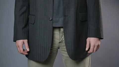Male in black jacket pulling his pants z... | Stock Video | Pond5