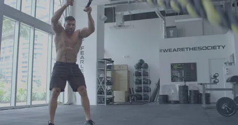 Male bodybuilder training with battle ro... | Stock Video | Pond5