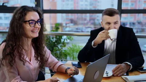 Male boss drinking coffee while one of h... | Stock Video | Pond5