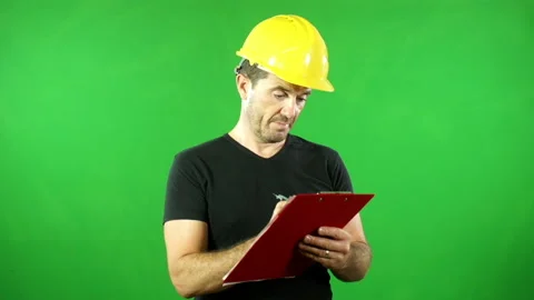 Male Builder Portrait - Taking notes on ... | Stock Video | Pond5