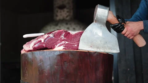 Male butcher hands chopping big meat pie... | Stock Video | Pond5