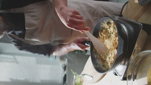 Male Chef Cooking Creamy Chicken in Pan | Stock Video | Pond5