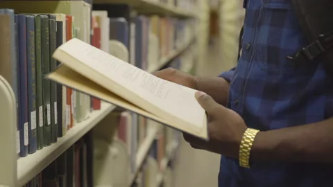 Male College Student Perusing the Pages ... | Stock Video | Pond5