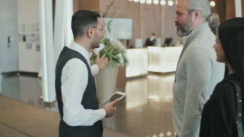 Male Concierge Welcoming Customers in Ho... | Stock Video | Pond5