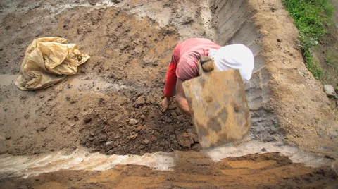 Male digging out soil material to make h... | Stock Video | Pond5