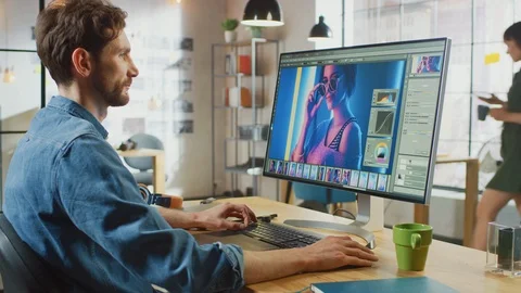 Male Digital Editor in Jeans Shirt Works... | Stock Video | Pond5