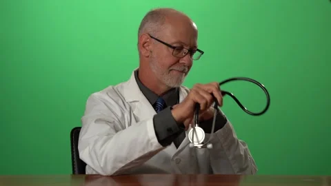 Male doctor wearing a lab coat and steth... | Stock Video | Pond5