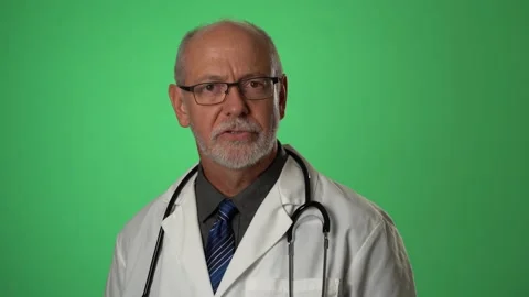 Male doctor wearing a lab coat and steth... | Stock Video | Pond5