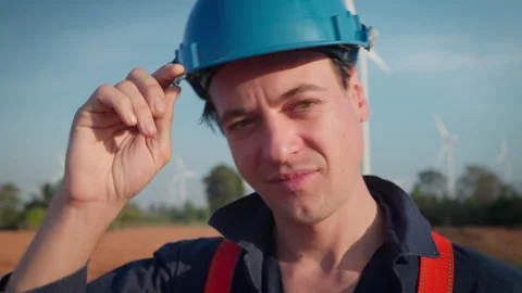 Male engineer looking to camera with win... | Stock Video | Pond5