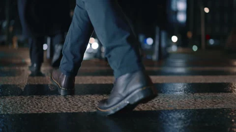 Male feet steps crossing busy street at ... | Stock Video | Pond5