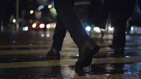 Male feet steps crossing busy street at ... | Stock Video | Pond5