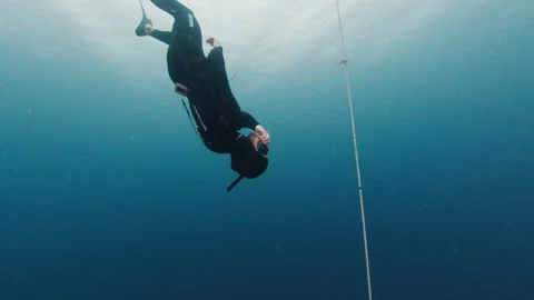 Male freediver trains free fall along th... | Stock Video | Pond5