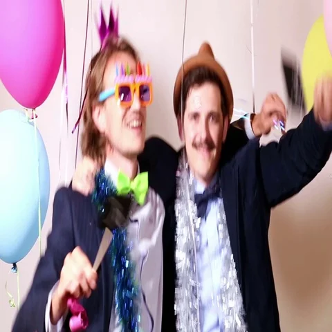 Male friends dancing with a sign in love... | Stock Video | Pond5