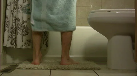 Male getting into shower. | Stock Video | Pond5