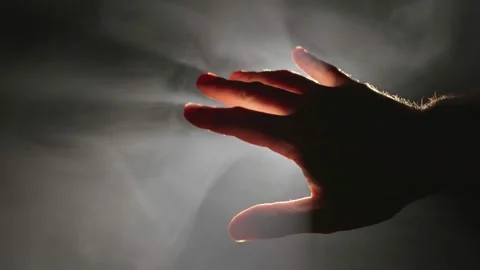Male hand in backlight on black backgrou... | Stock Video | Pond5