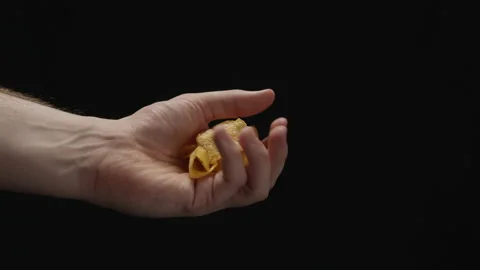 Male hand drops junk food habit, crushed... | Stock Video | Pond5