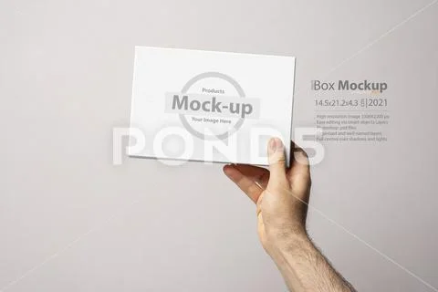 PSD Template: A male hand holding a hardbox mock-up series #171772345