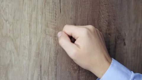 Male hand knocking on wooden door | Stock Video | Pond5
