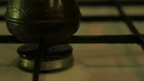 Male hand lights a gas burner on a gas k... | Stock Video | Pond5