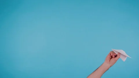 Male hand playing with paper plane isola... | Stock Video | Pond5