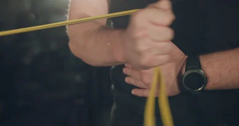 Male hand pulling loop for arm muscles i... | Stock Video | Pond5