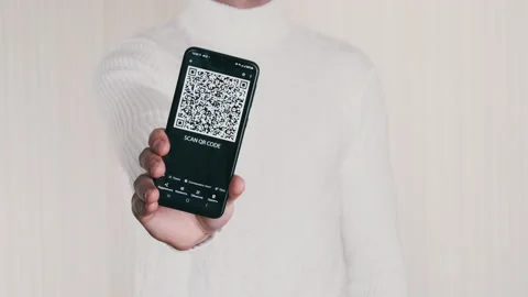 Male Hand Shows QR Code on Smartphone on... | Stock Video | Pond5
