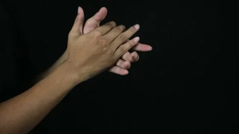 Male hands clapping against a black back... | Stock Video | Pond5