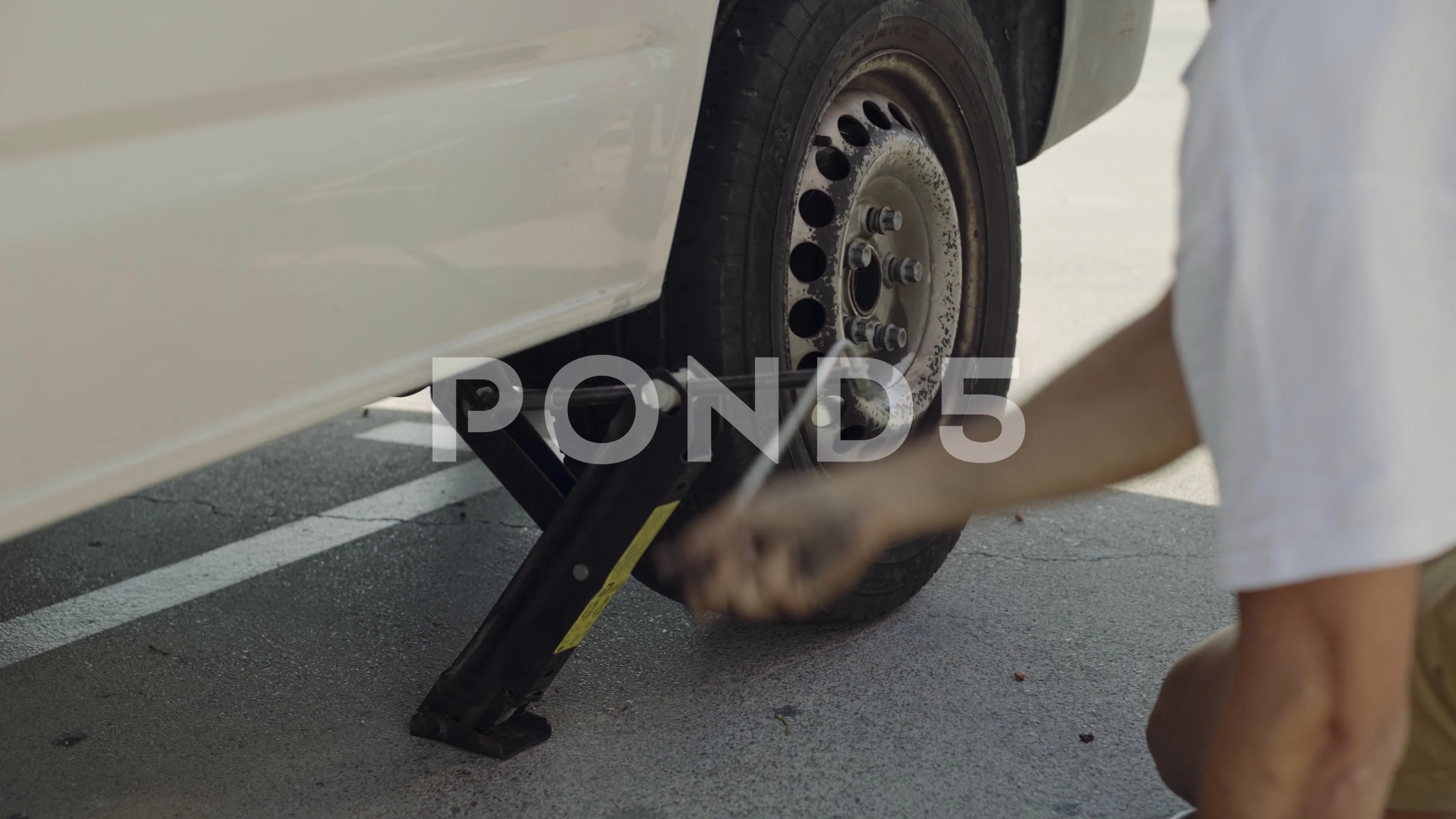 Guy Fixing Flat Tire