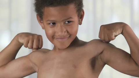 Kid Flexing Stock Footage ~ Royalty Free Stock Videos | Pond5