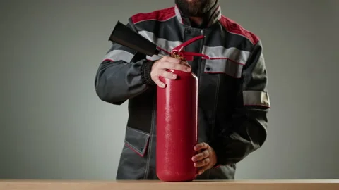 Male man hands hold a fire extinguisher,... | Stock Video | Pond5