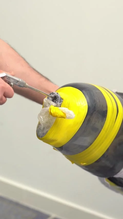 Male master blowing air prosthetic limb.... | Stock Video | Pond5