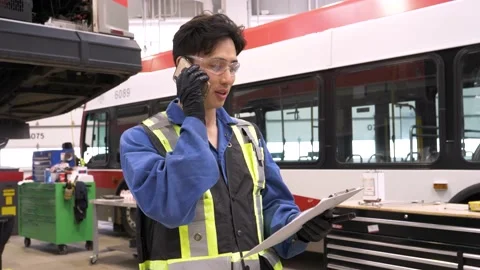 Male mechanic talking on smart phone in ... | Stock Video | Pond5