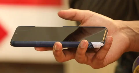 Male Model hands with cell phone | Stock Video | Pond5