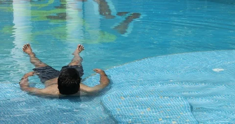 Male Model in Swimming pool | Stock Video | Pond5