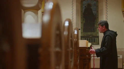Male Monk Reading Bible At Altar, Medium... | Stock Video | Pond5