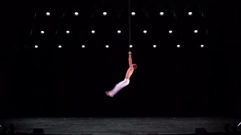 Male, muscular acrobat on Aerial straps ... | Stock Video | Pond5