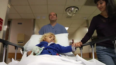 Male nurse pushing little boy on stretch... | Stock Video | Pond5
