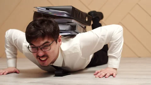 Male office worker is pinned down by sta... | Stock Video | Pond5