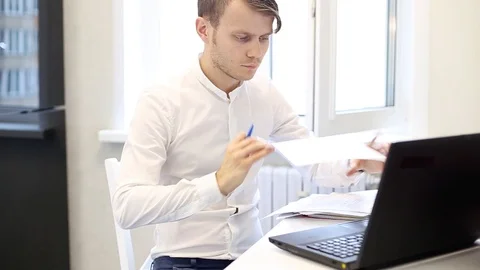 male office worker signs the documents. ... | Stock Video | Pond5