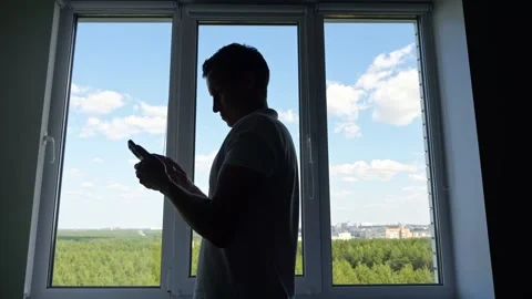 Male office worker walking to window scr... | Stock Video | Pond5