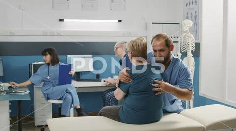 Male osteopath cracking spine bones at physical recovery Stock Image ...