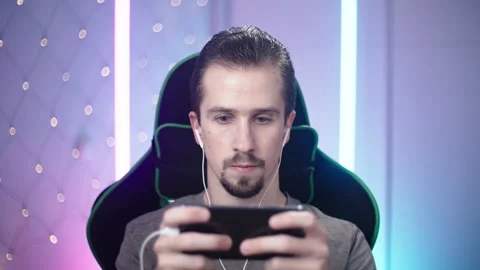 Male person gaming on smartphone in cybe... | Stock Video | Pond5