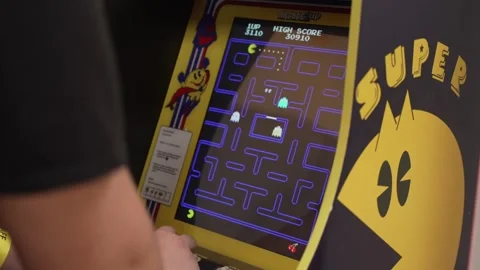 Male Playing Pac Man Arcade Game at Conn... | Stock Video | Pond5