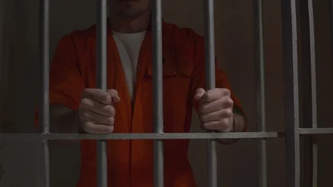 Male Prisoner Inmate behind bars in a Ja... | Stock Video | Pond5