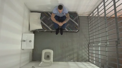 Male Prisoner in Prison Cell. The inmate... | Stock Video | Pond5