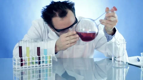 Male scientist mixing Volumetric flask w... | Stock Video | Pond5