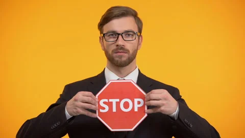 Male showing stop sign, shaking head to ... | Stock Video | Pond5