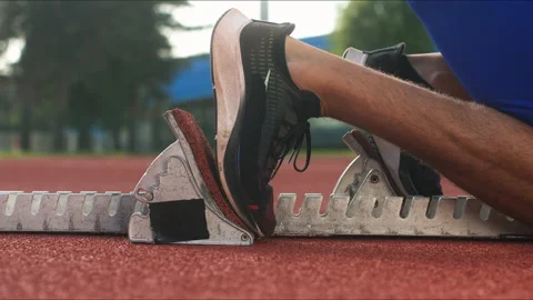 Male sprinter feet pushing off from the ... | Stock Video | Pond5