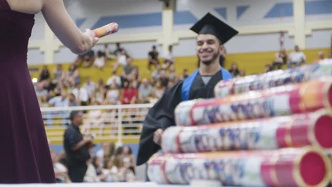 male student at graduation is handed a d... | Stock Video | Pond5