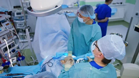 Male surgeon uses modern device tool at ... | Stock Video | Pond5